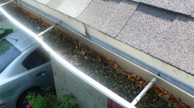 Rain gutter installed with spikes.